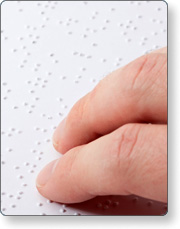 Person reading Braille document