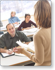 Facilitator conducting training for a classroom of adults