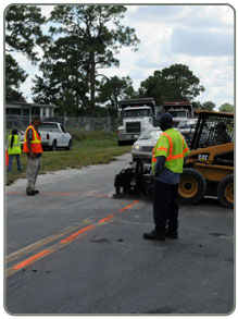 Image of workers fixing a road